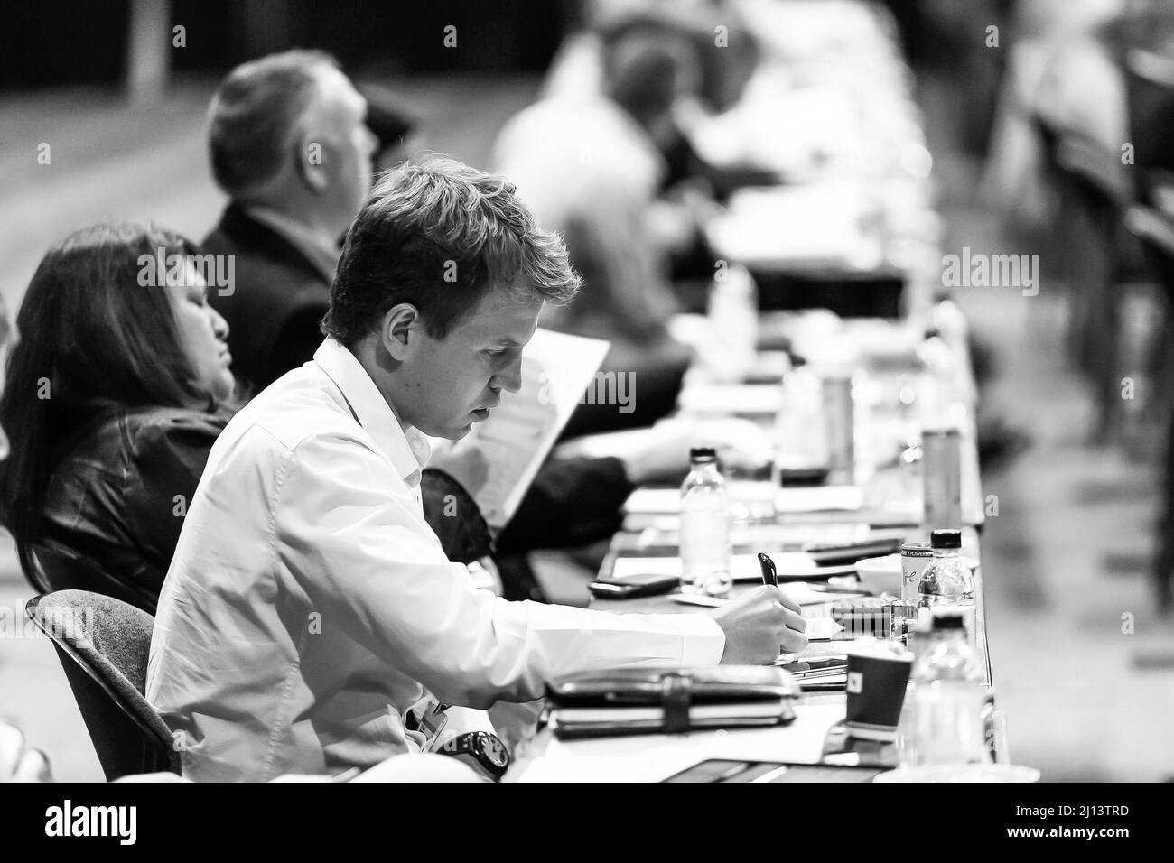 Delegates attending a sales convention in large conference hall Stock ...