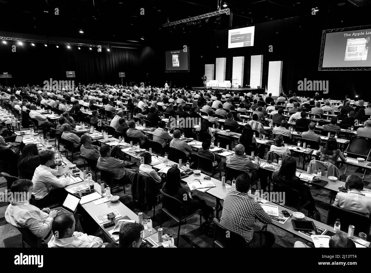 Delegates attending a sales convention in large conference hall Stock ...