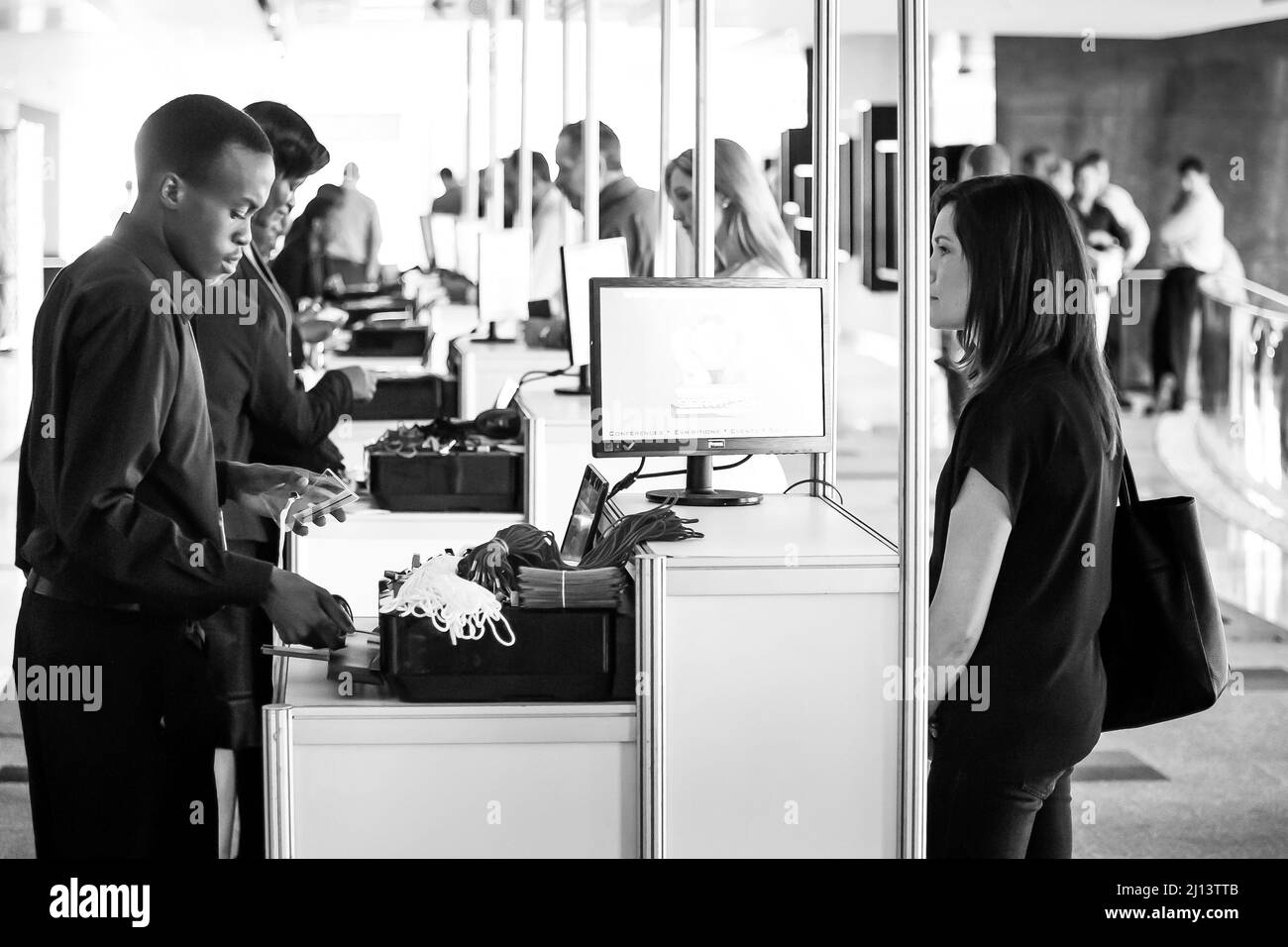 Delegates registering at sign in booth for sales convention at c Stock ...