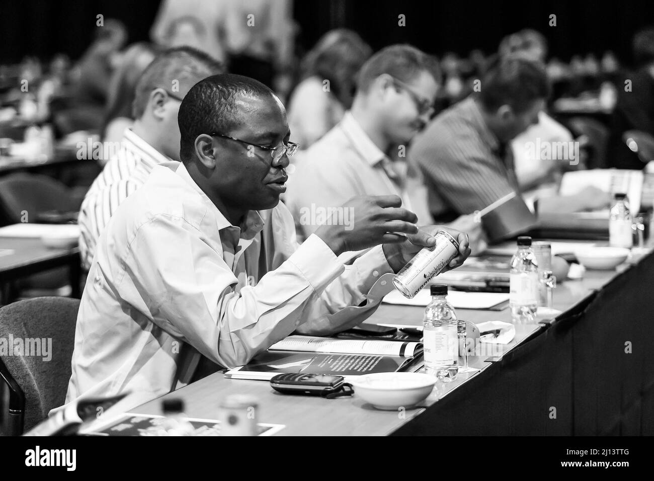 Delegates attending a sales convention in large conference hall Stock ...