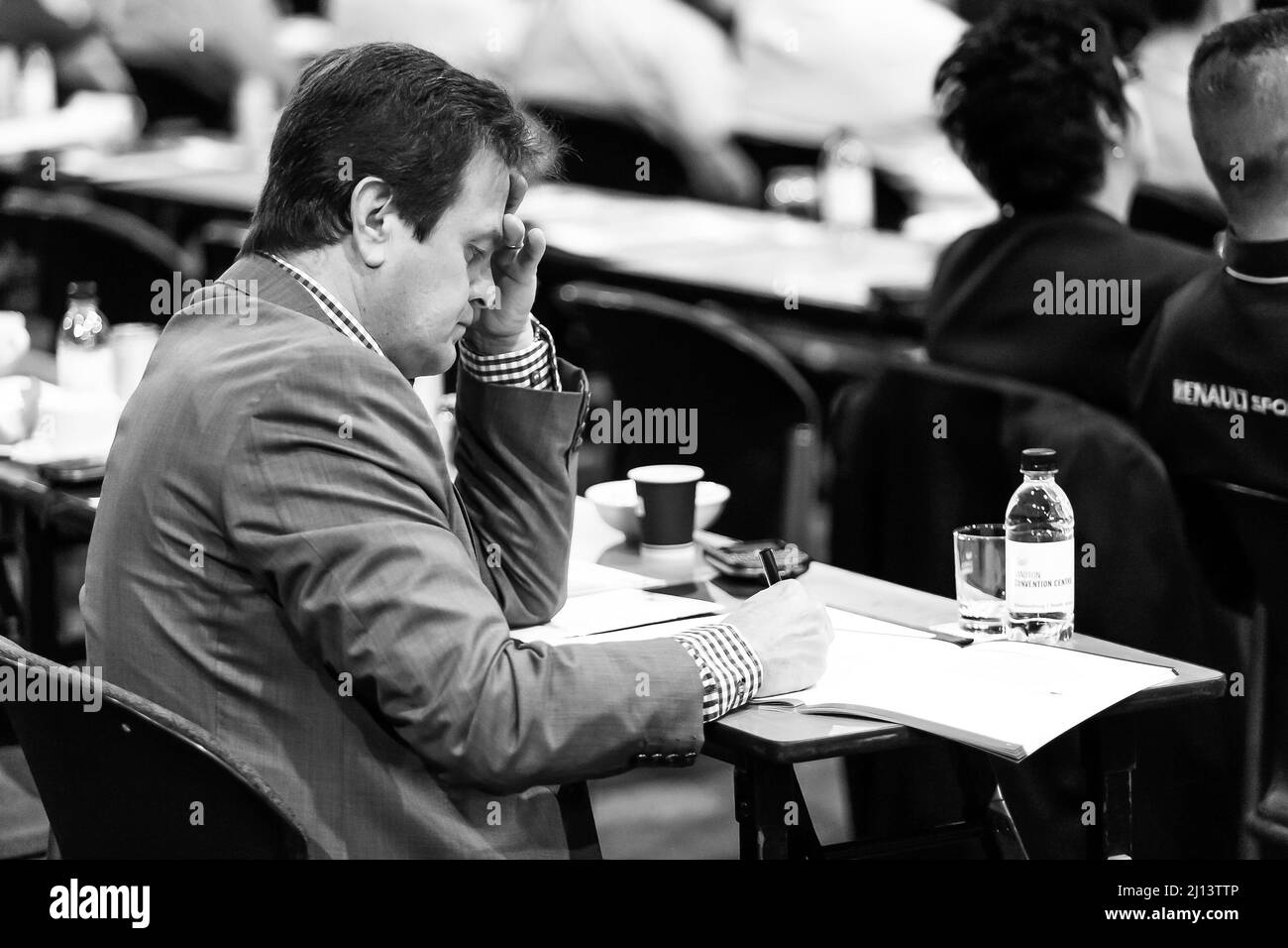 Delegates attending a sales convention in large conference hall Stock ...