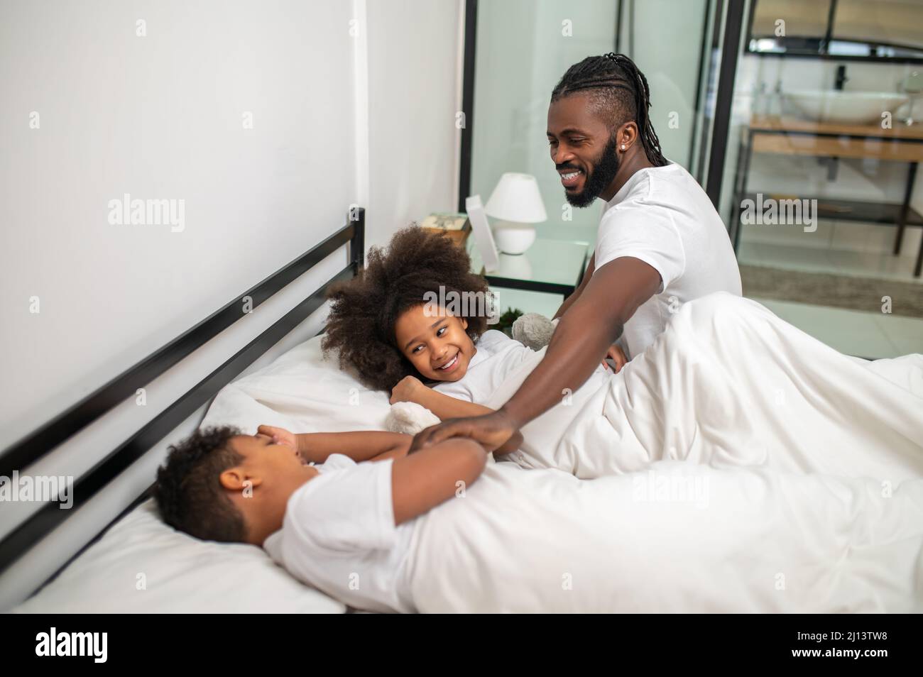 Child waking up bed hi-res stock photography and images - Alamy