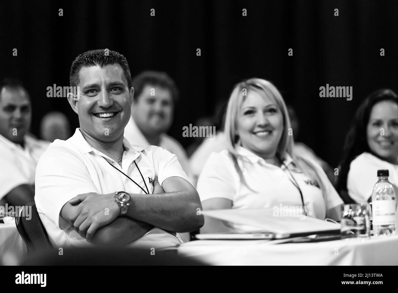 Delegates attending a sales convention in large conference hall Stock ...