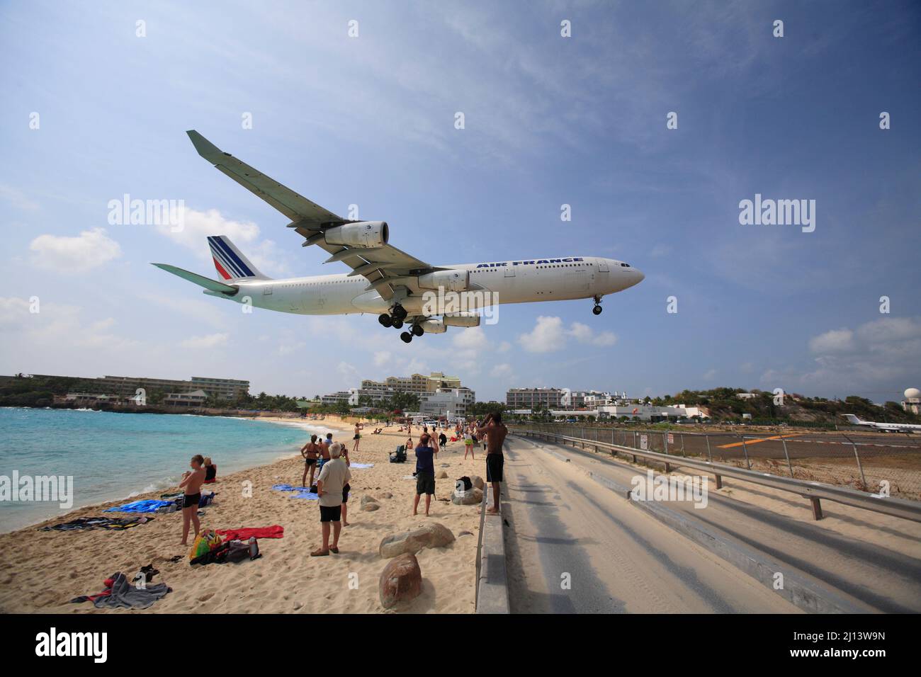 Airplane landing in St Martin Caribbean island Stock Photo - Alamy