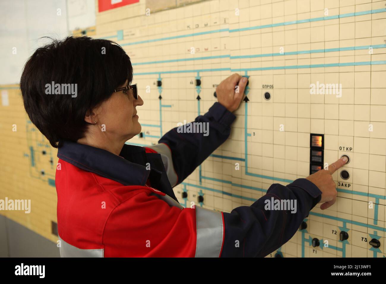 Workers at the oil and gas station. Shut off the gas, control station ...