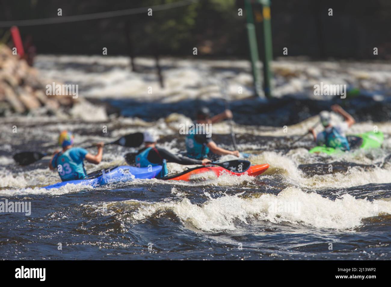 Kayak slalom canoe race in white water rapid river, process of kayaking ...