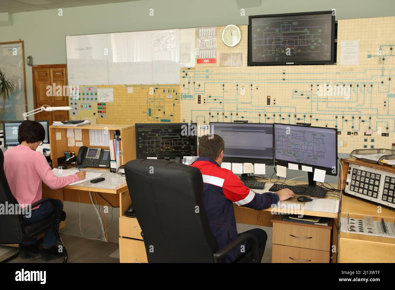 Workers at the oil and gas station. Shut off the gas, control station ...