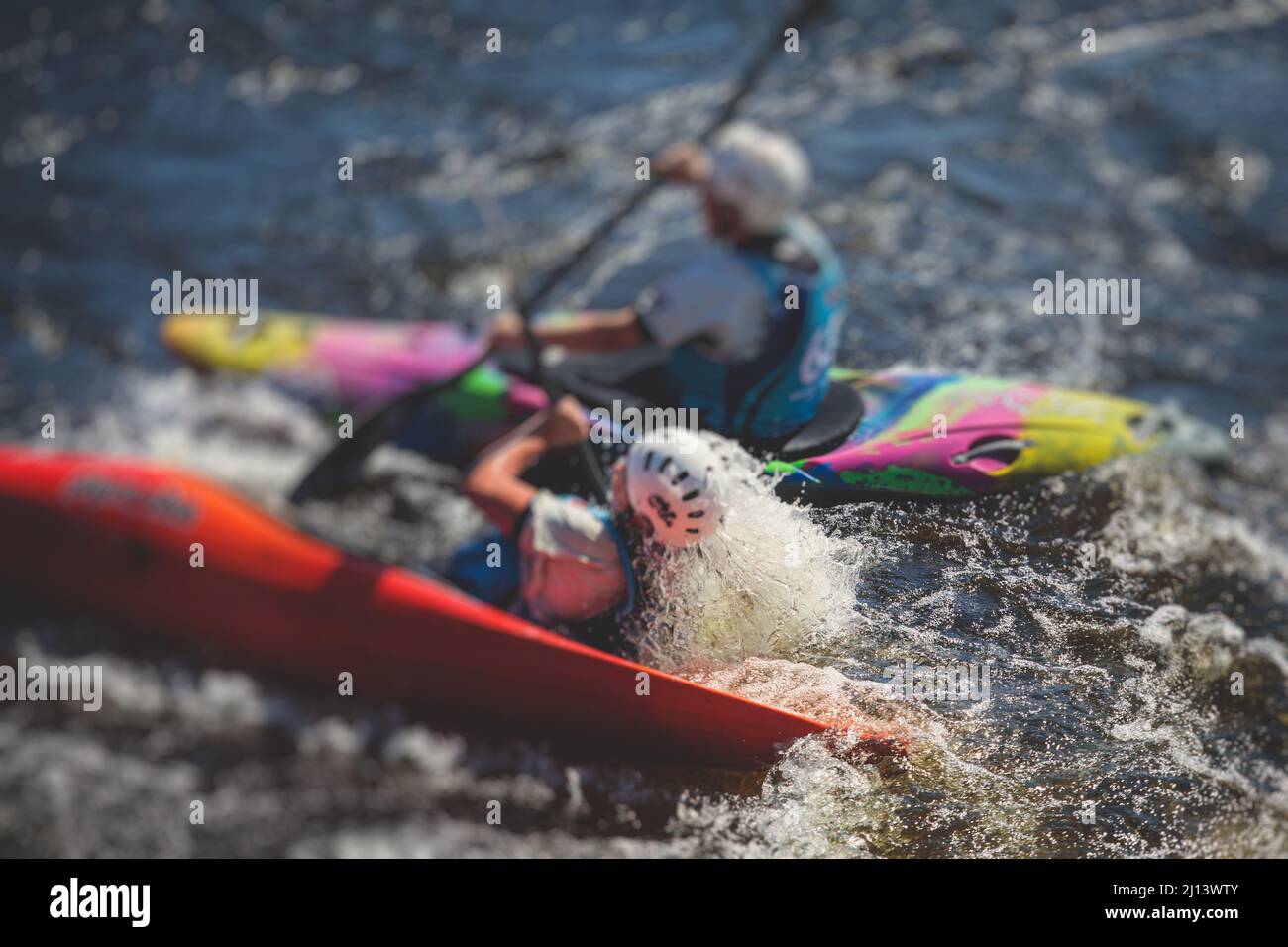 Kayak slalom canoe race in white water rapid river, process of kayaking ...