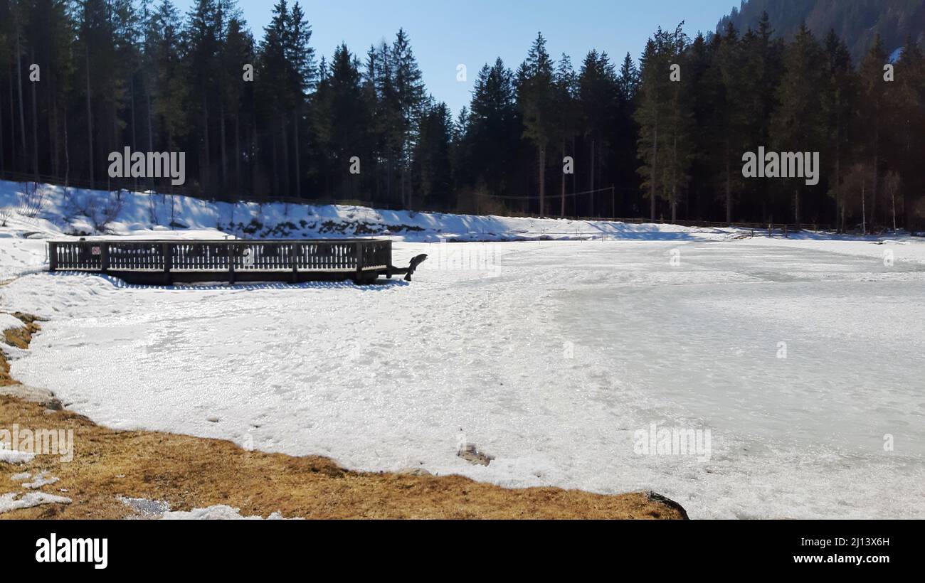 Small frozen lake for sport fishing in the Antholz Valley. In this ...