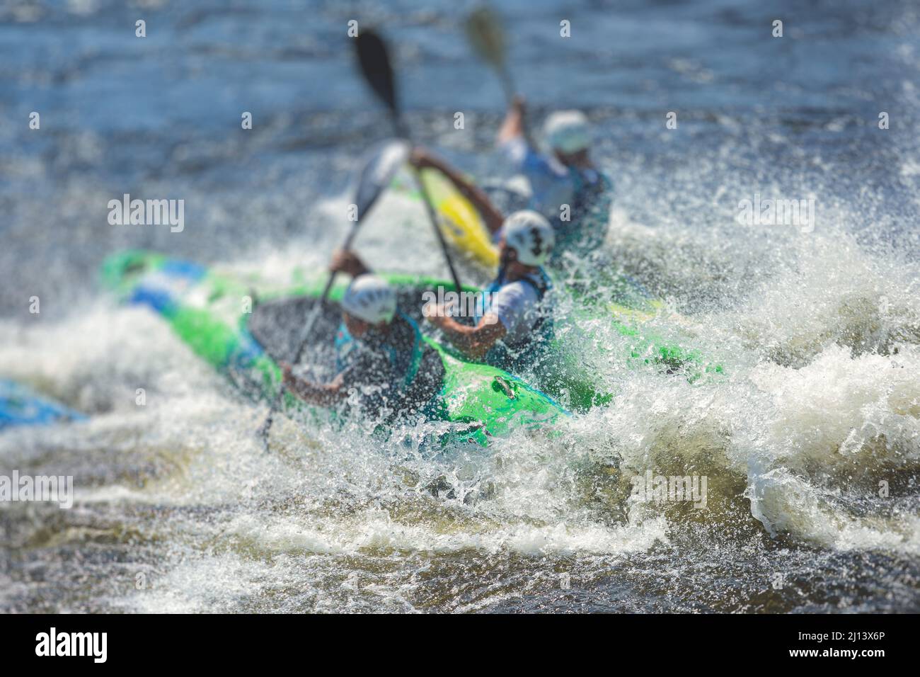 Kayak slalom canoe race in white water rapid river, process of kayaking ...