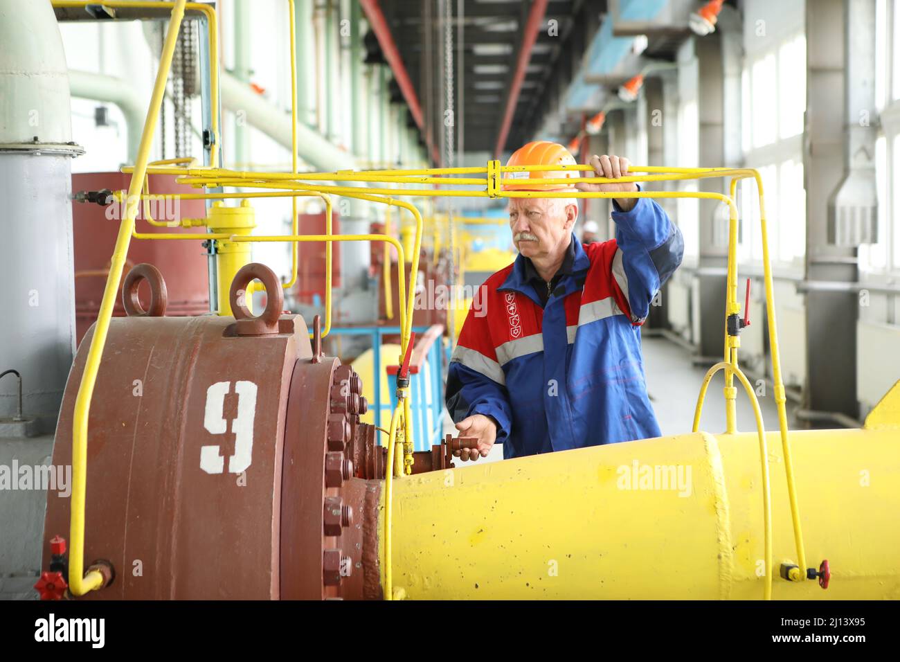 Workers at the oil and gas station. Shut off the gas, control station ...
