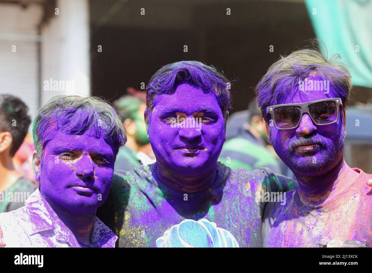 Indore, India. 22nd Mar, 2022. Revelers with their faces painted with ...