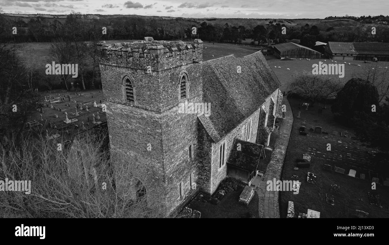 Grayscale aerial shot of a building in a graveyard Stock Photo - Alamy