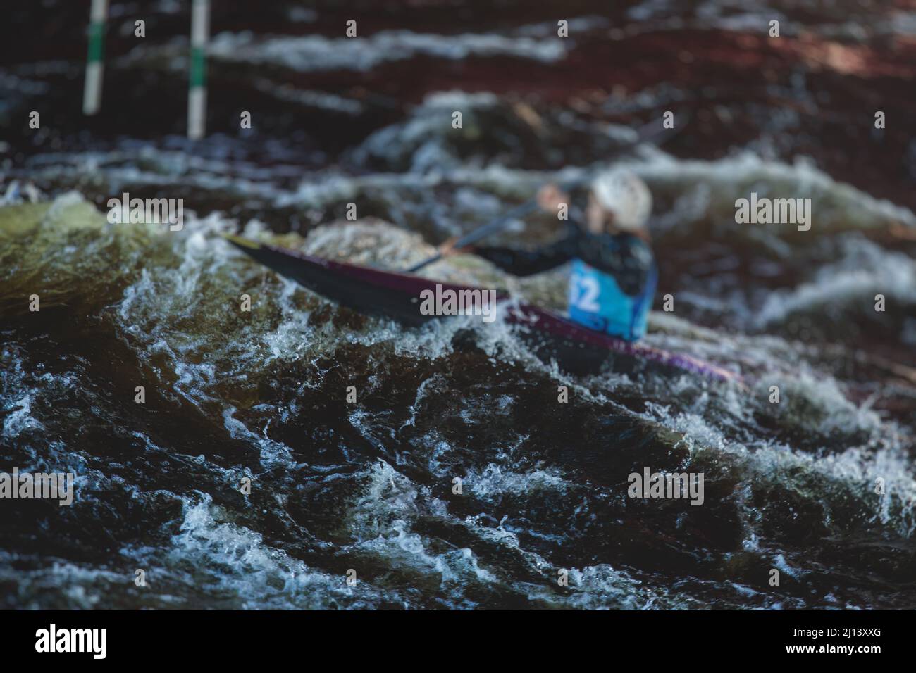 Kayak slalom canoe race in white water rapid river, process of kayaking ...