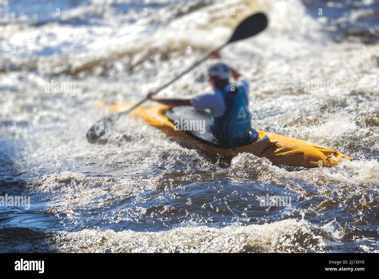 Kayak slalom canoe race in white water rapid river, process of kayaking ...