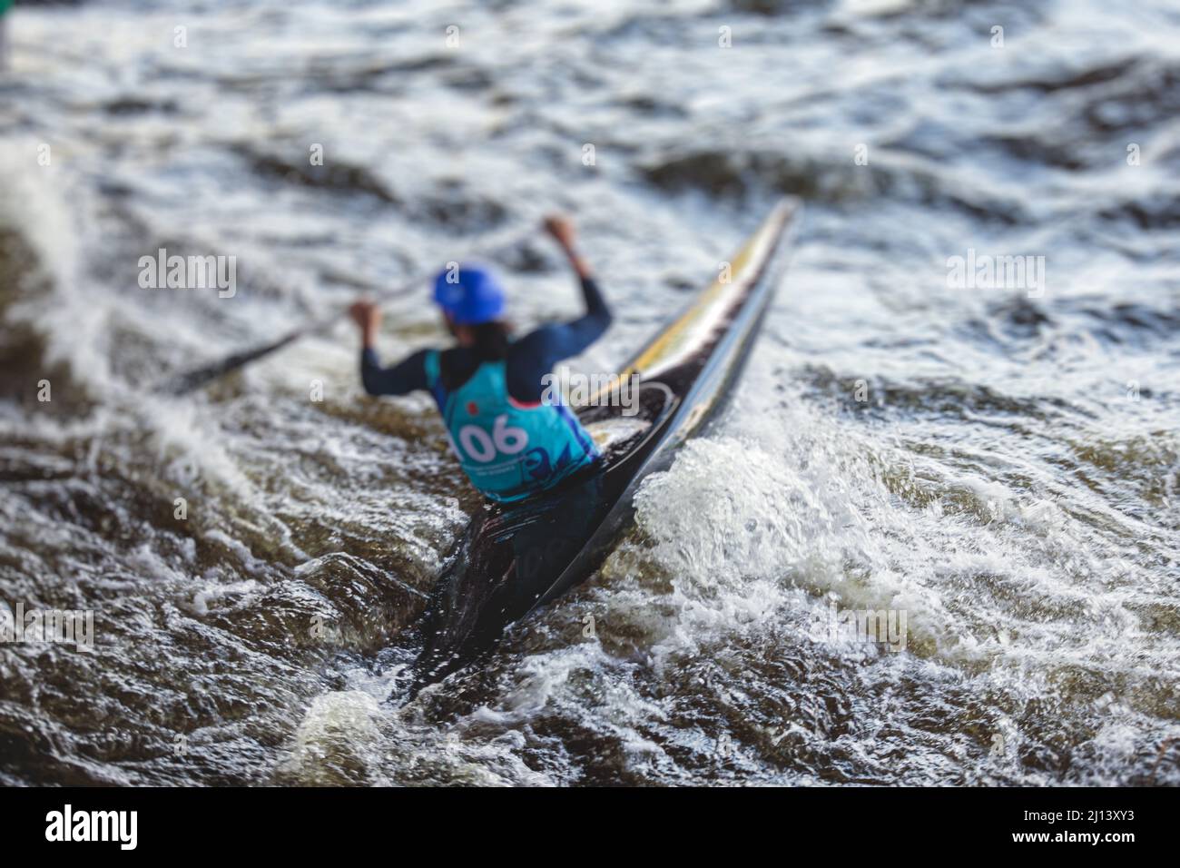 Kayak slalom canoe race in white water rapid river, process of kayaking ...