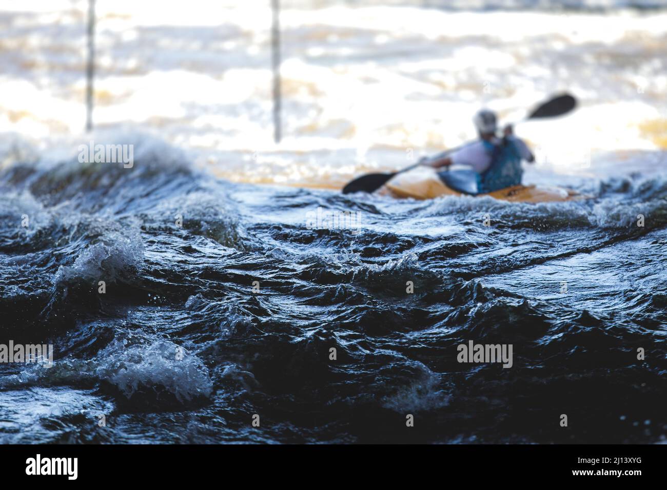 Kayak slalom canoe race in white water rapid river, process of kayaking ...
