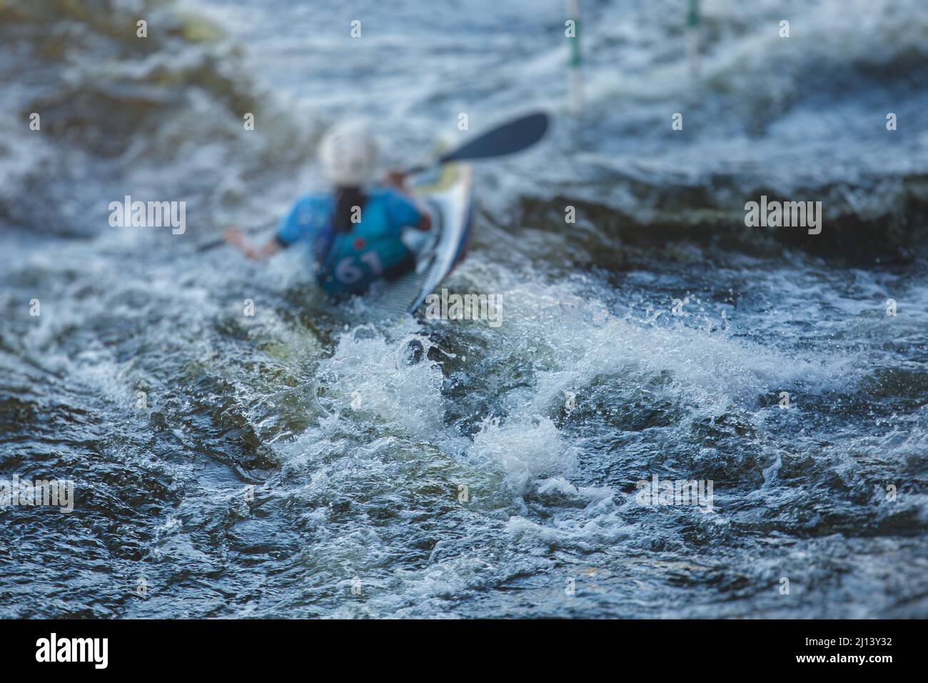 Kayak slalom canoe race in white water rapid river, process of kayaking ...