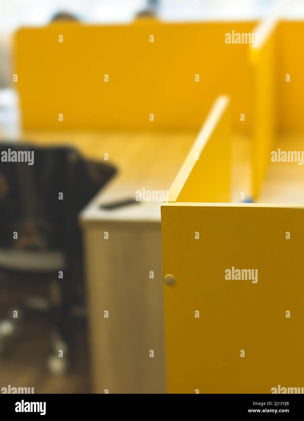 View of modern office space interior with desks in yellow tones with ...