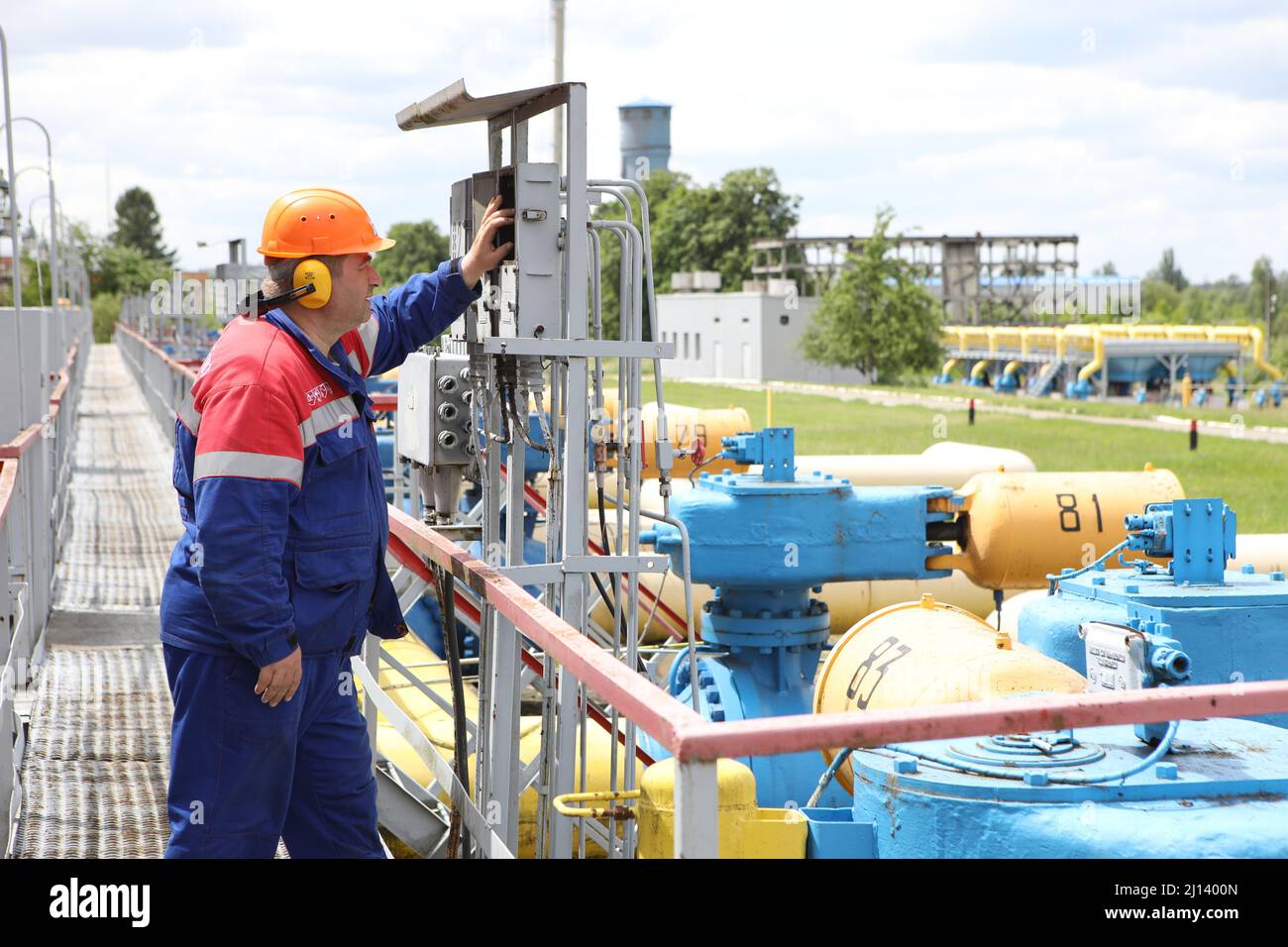 Workers at the oil and gas station. Shut off the gas, control station ...
