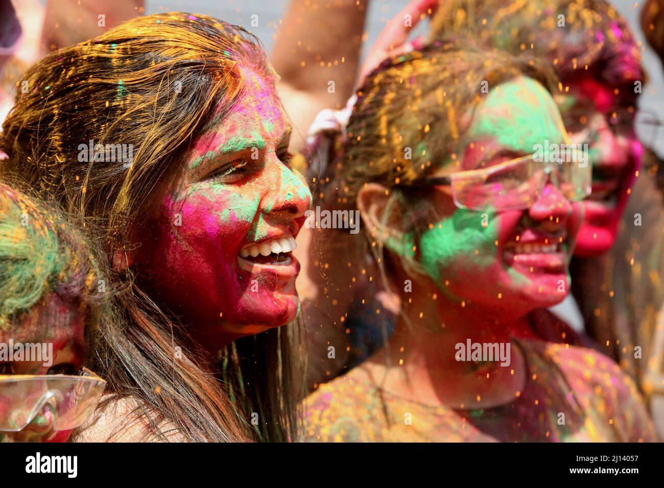Revelers with their faces painted with colors during a procession on ...