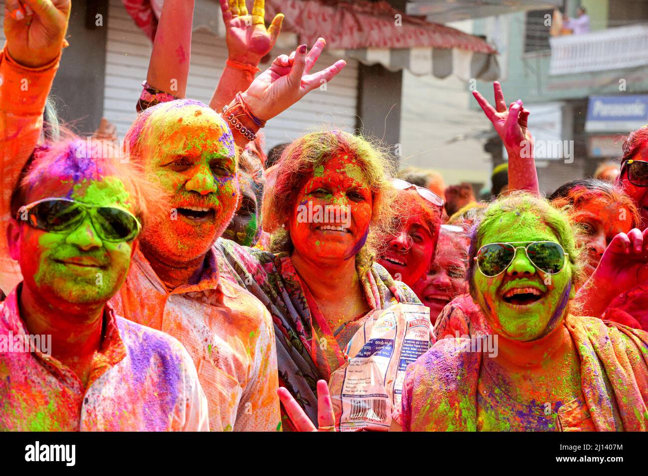Revelers with their faces painted with colors during a procession on ...