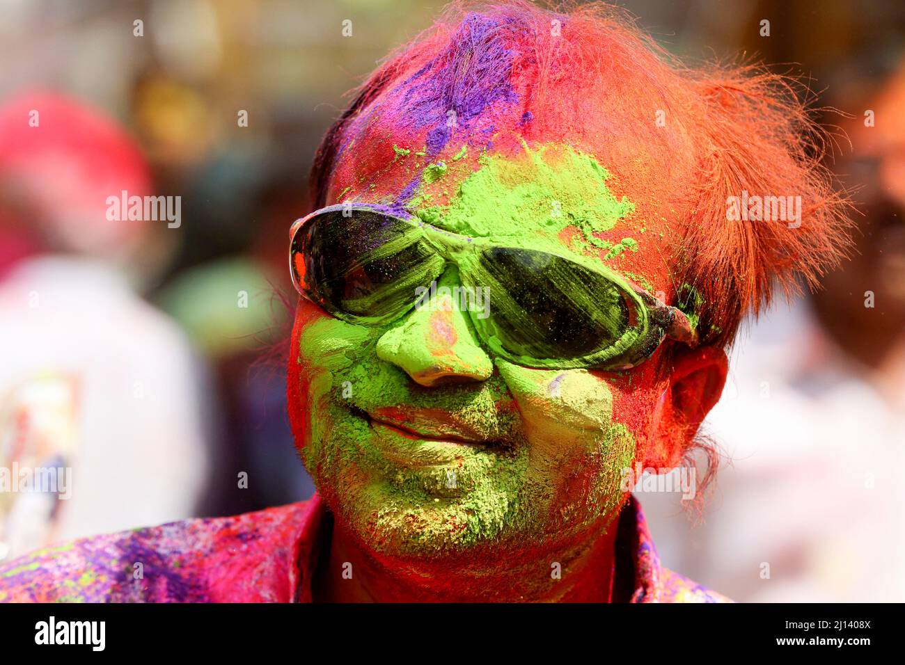 Indore, India. 22nd Mar, 2022. A reveler with a colorful painted face ...