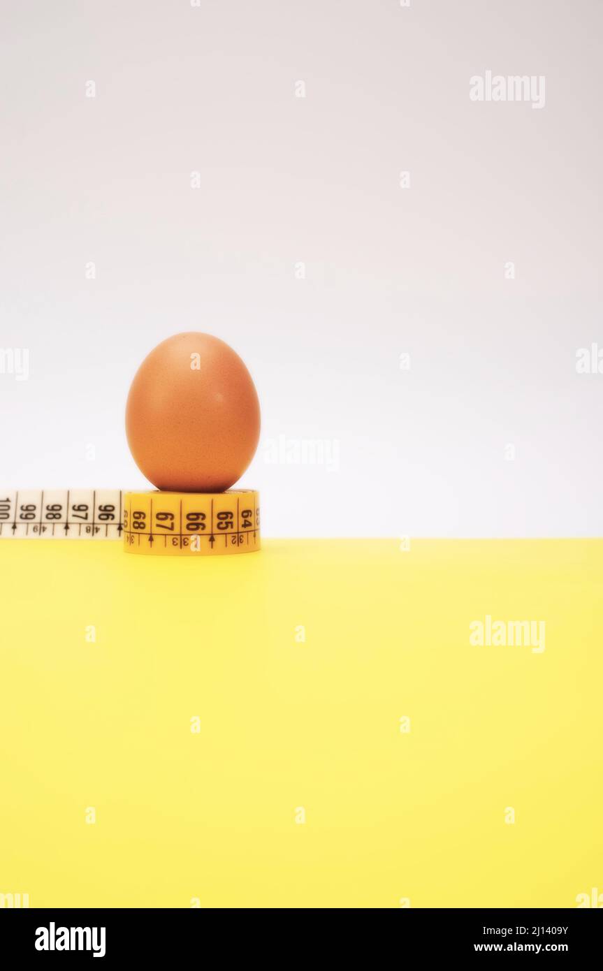 Healthy nutrition and fit concept - organic brown egg wrapped in a ...