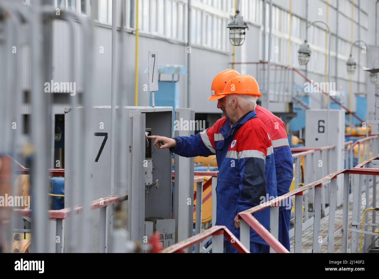 Workers at the oil and gas station. Shut off the gas, control station ...