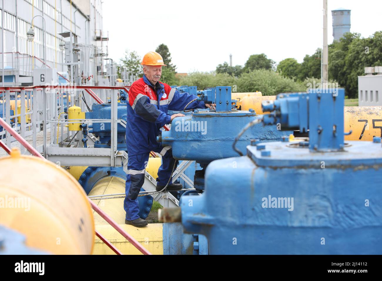 Workers at the oil and gas station. Shut off the gas, control station ...