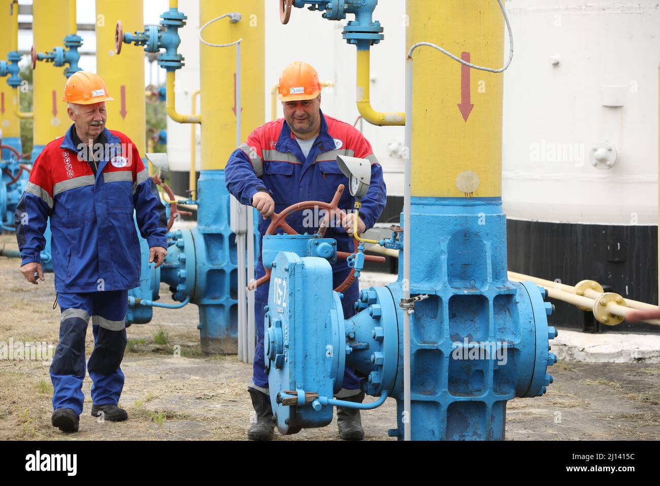 Workers at the oil and gas station. Shut off the gas, control station ...