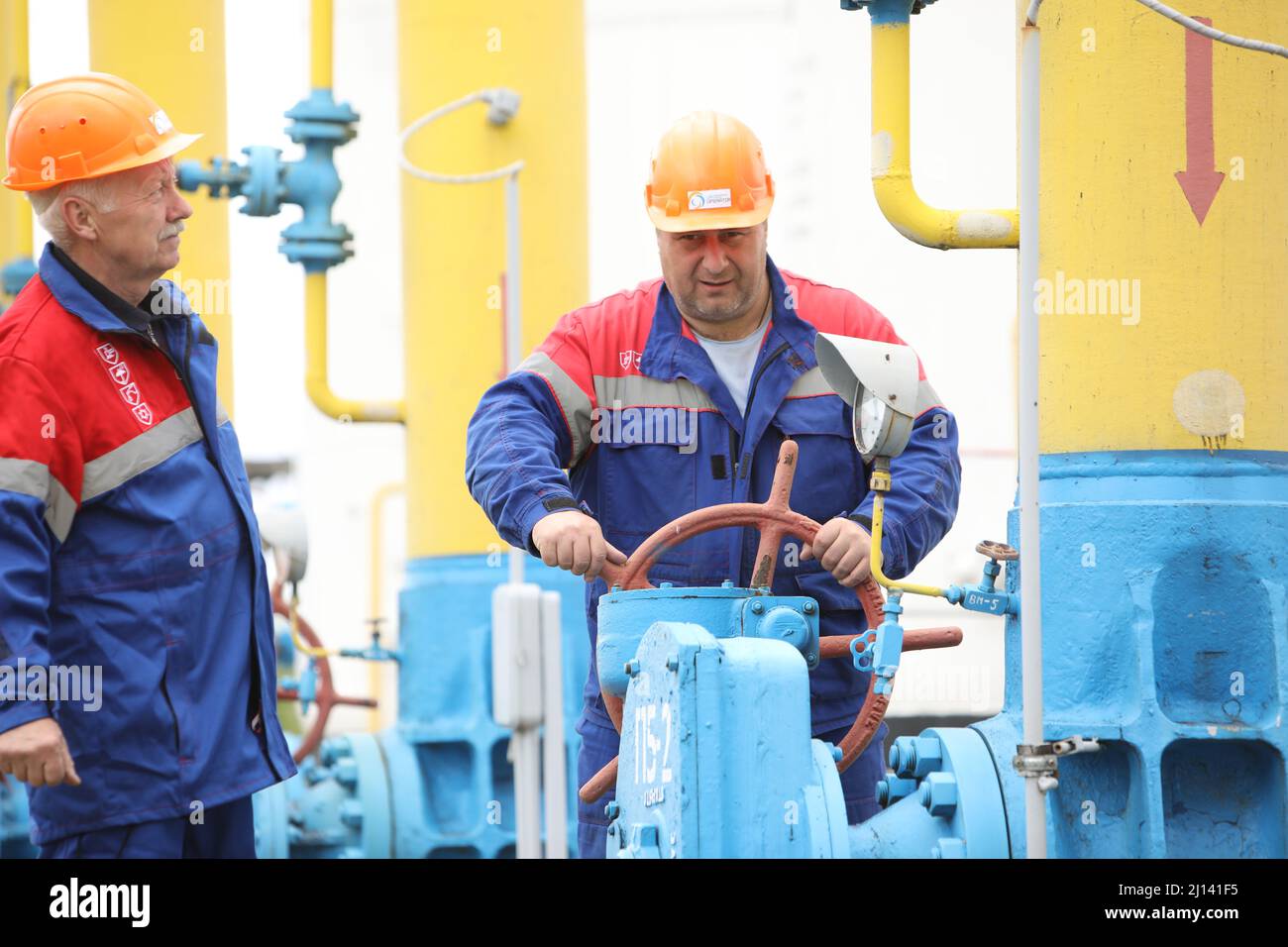 Workers at the oil and gas station. Shut off the gas, control station ...