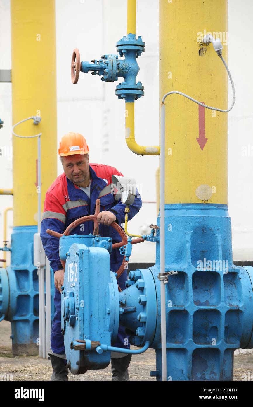 Workers at the oil and gas station. Shut off the gas, control station ...