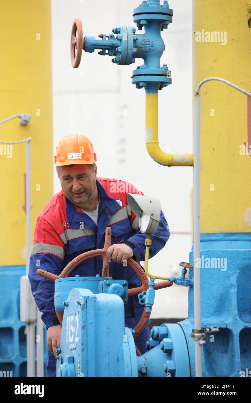 Workers at the oil and gas station. Shut off the gas, control station ...