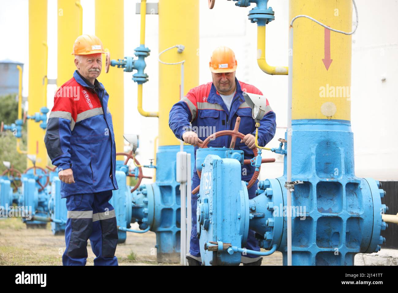 Workers at the oil and gas station. Shut off the gas, control station ...