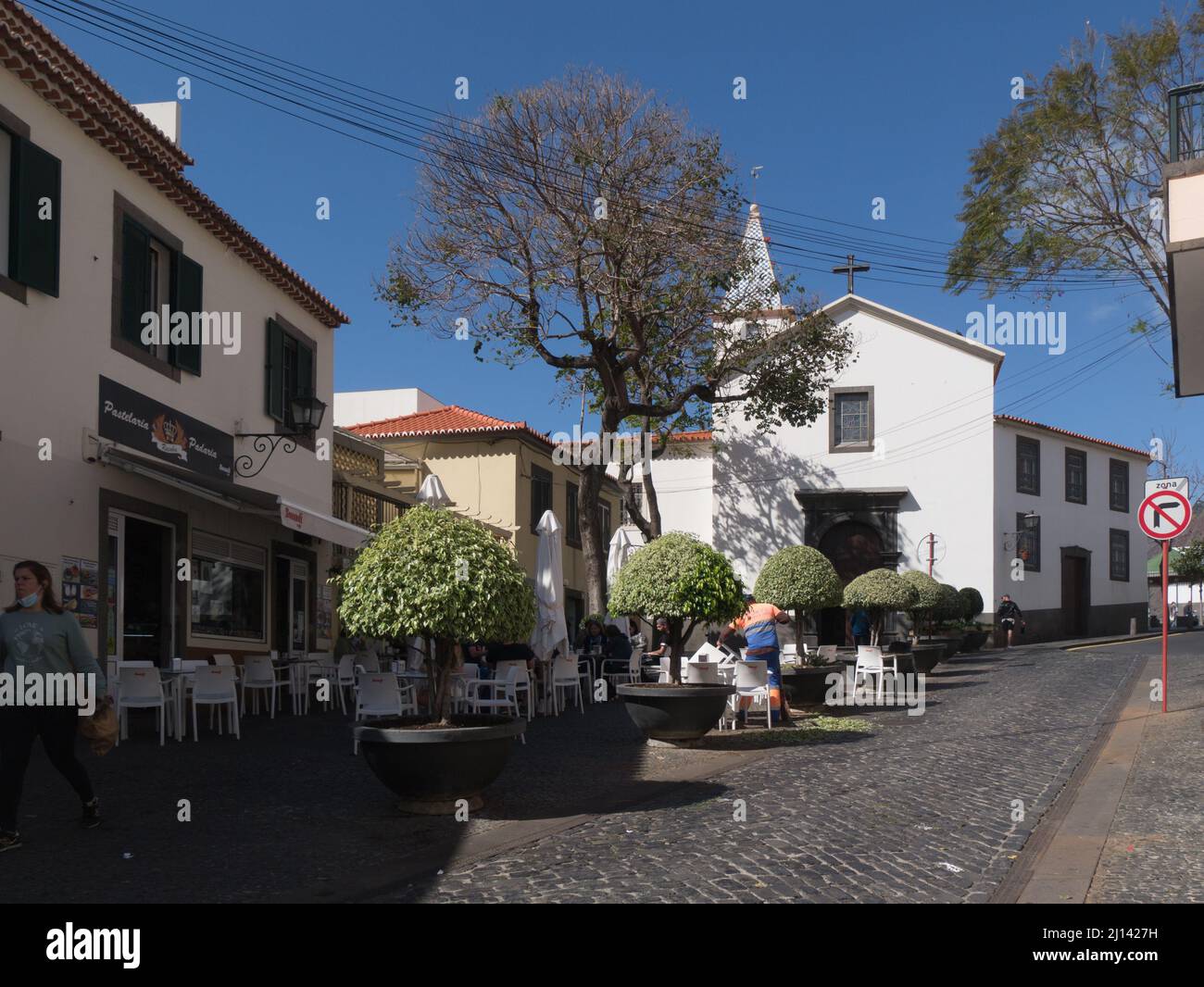 View along Largo do Poco one of main streets of lovely fishing village ...
