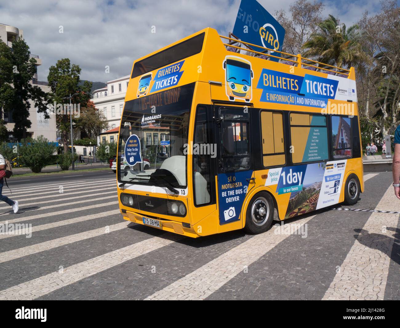 Yellow bus used as sales office to sell tickets for local buses on ...