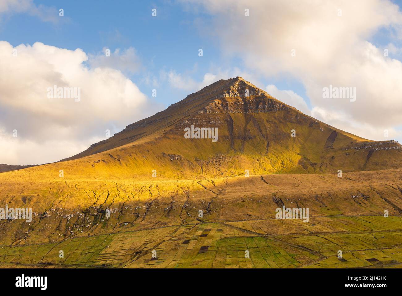 Mountain landscape on the island of Eysturoy. Sunny spring evening ...