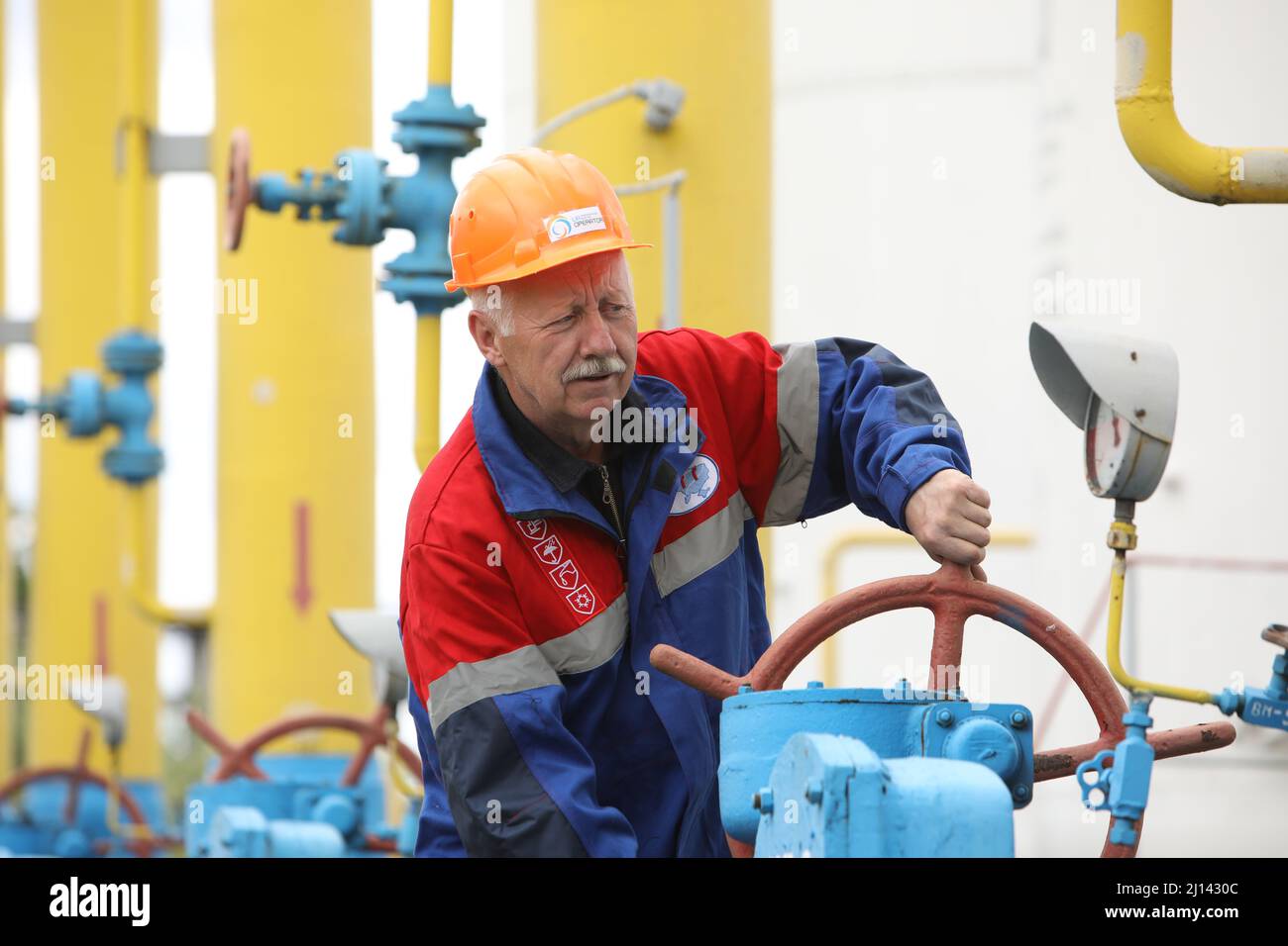 Workers at the oil and gas station. Shut off the gas, control station ...