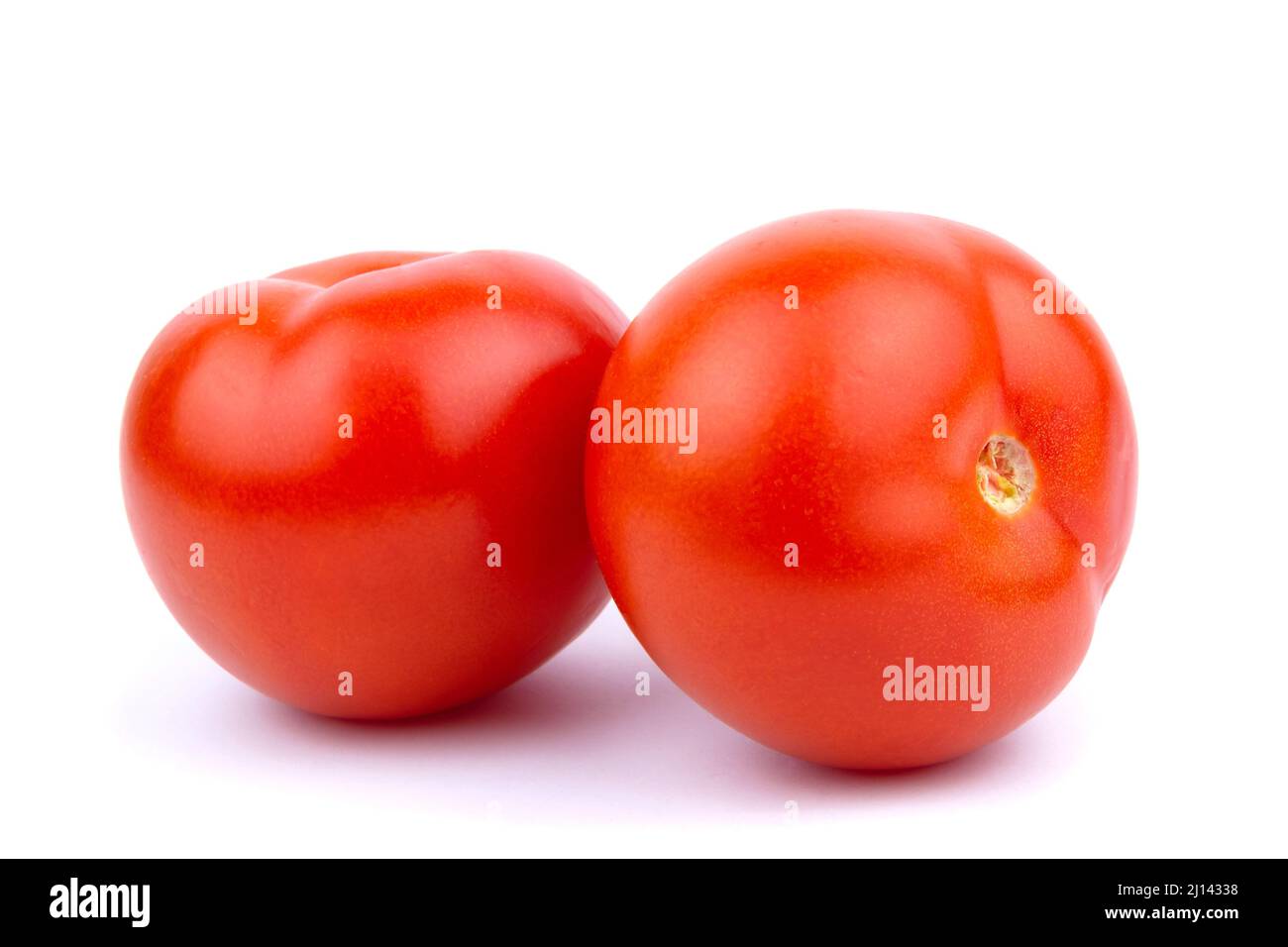 Two Juicy red tomatoes isolated on white background Stock Photo - Alamy