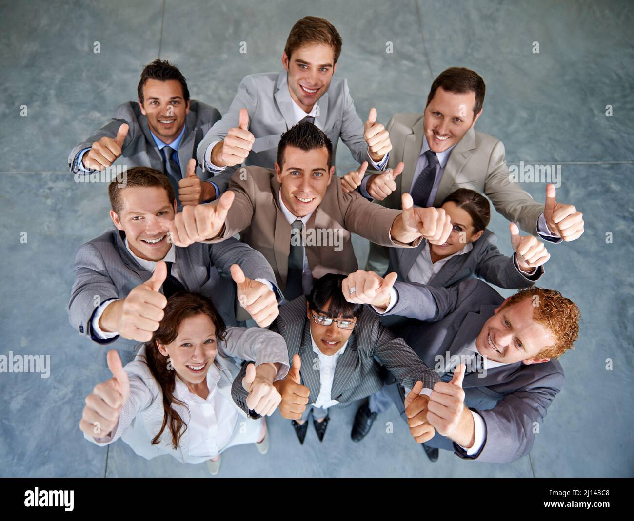 Emphatic approval. Top view of a successful business team giving you an ...