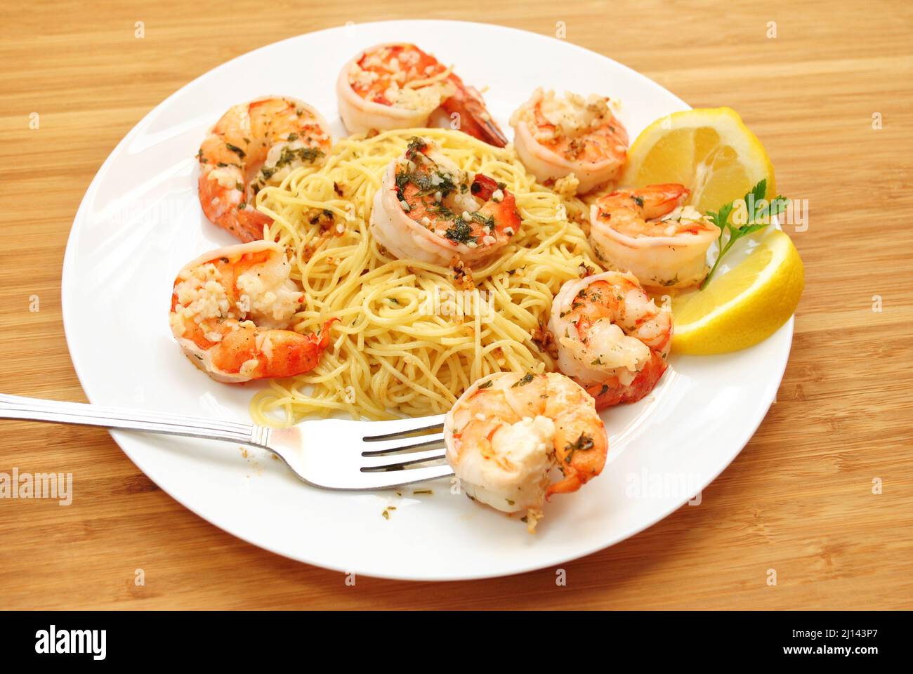 Meal of Jumbo Tiger Shrimp Scampi & Pasta Stock Photo - Alamy