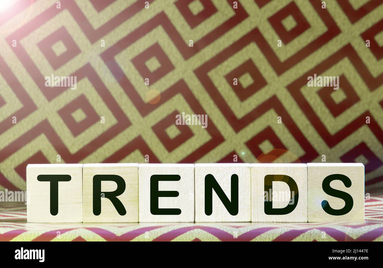 The word TRENDS written in vintage metal letterpress type on a soft ...