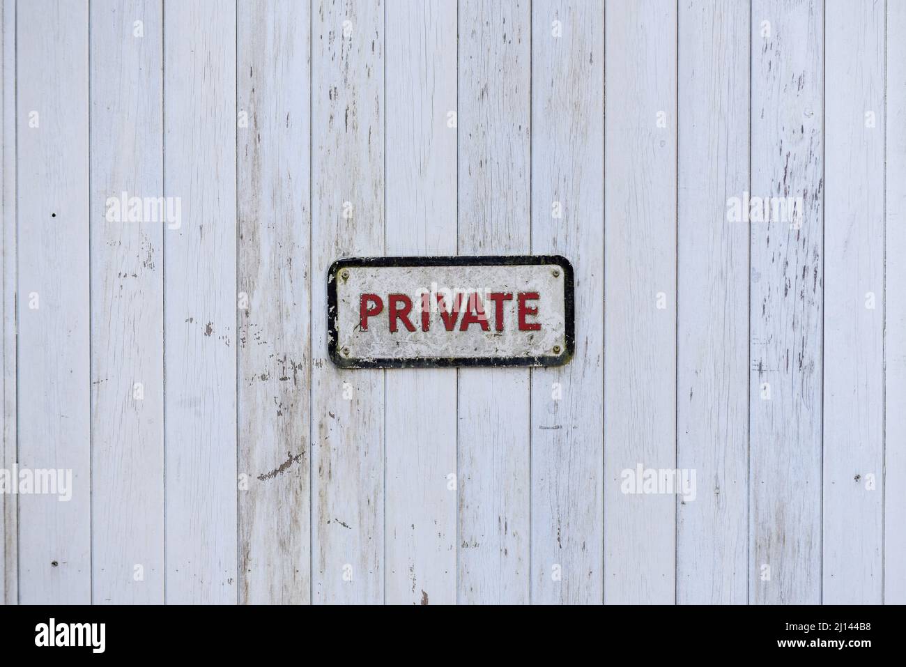 Private sign in red text on a wooden background Stock Photo - Alamy