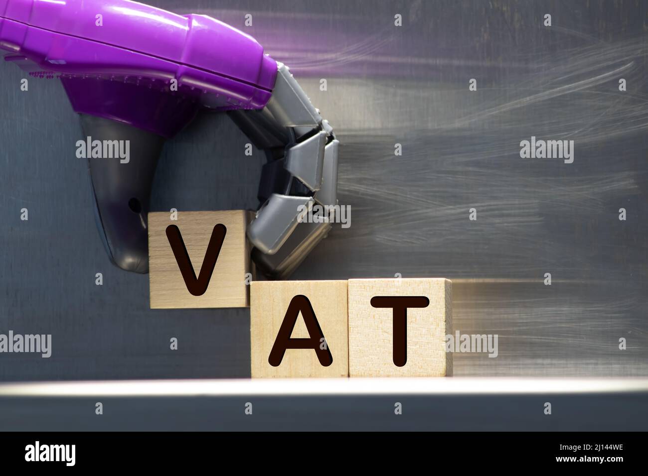 VAT text Value Added Tax on wood pieces isolated on white note pad ...