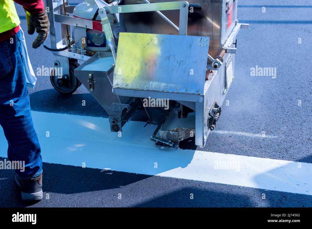 Thermoplastic road marking paint hi-res stock photography and images ...