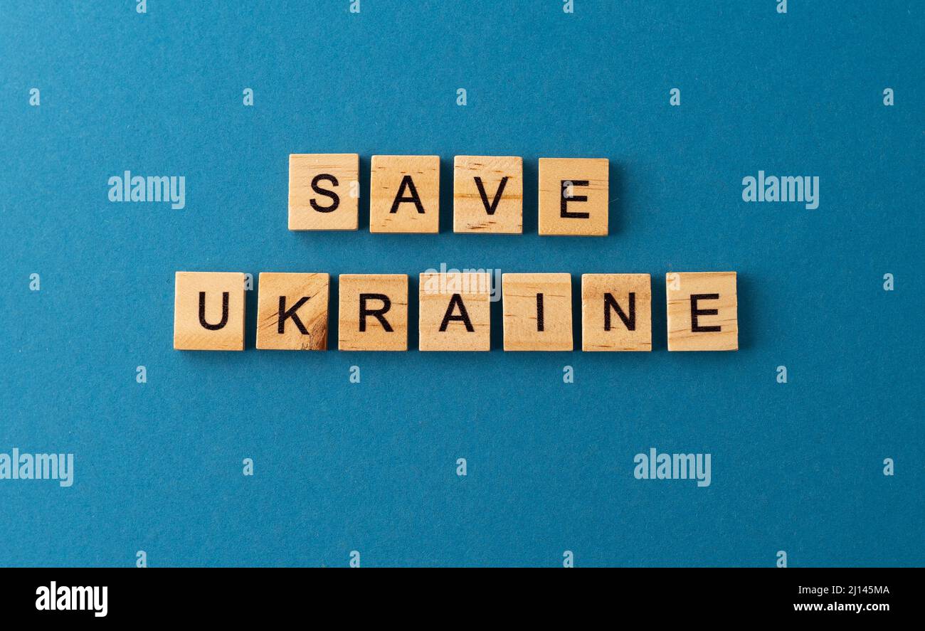 Save Ukraine background. Phrase from wooden letters. Top view words ...