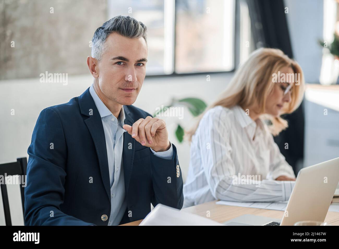 Two colleagues working together in the office Stock Photo - Alamy