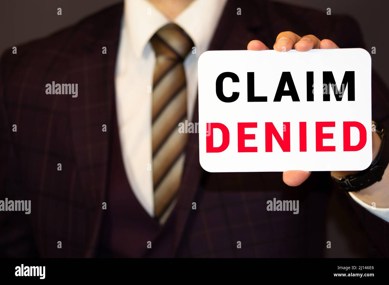 Businessman putting a card with text Claim Denied in the pocket Stock ... Businessman putting a card with text Claim Denied in the pocket Stock ...