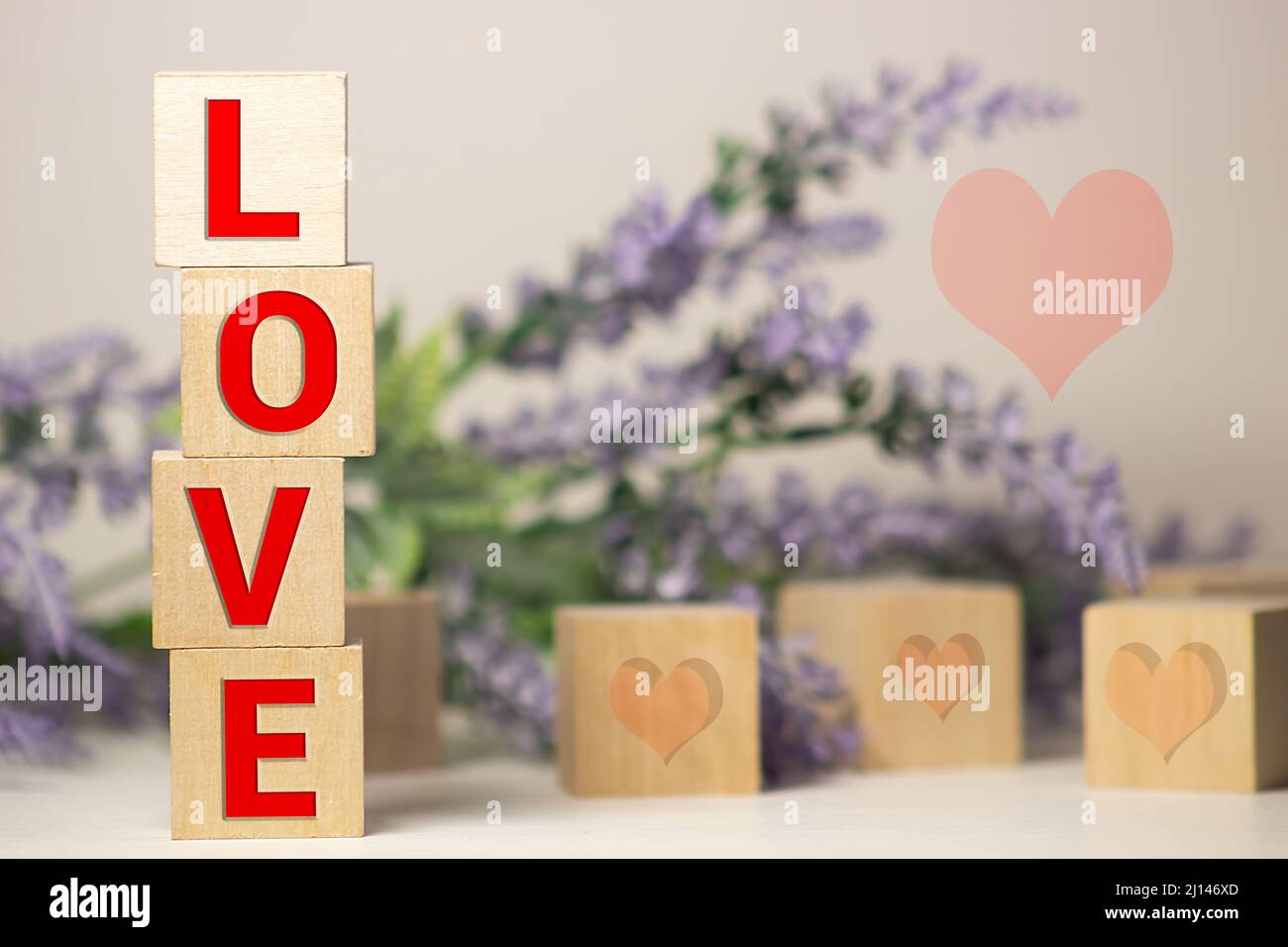 Love message written in wooden blocks. Red heart Stock Photo - Alamy